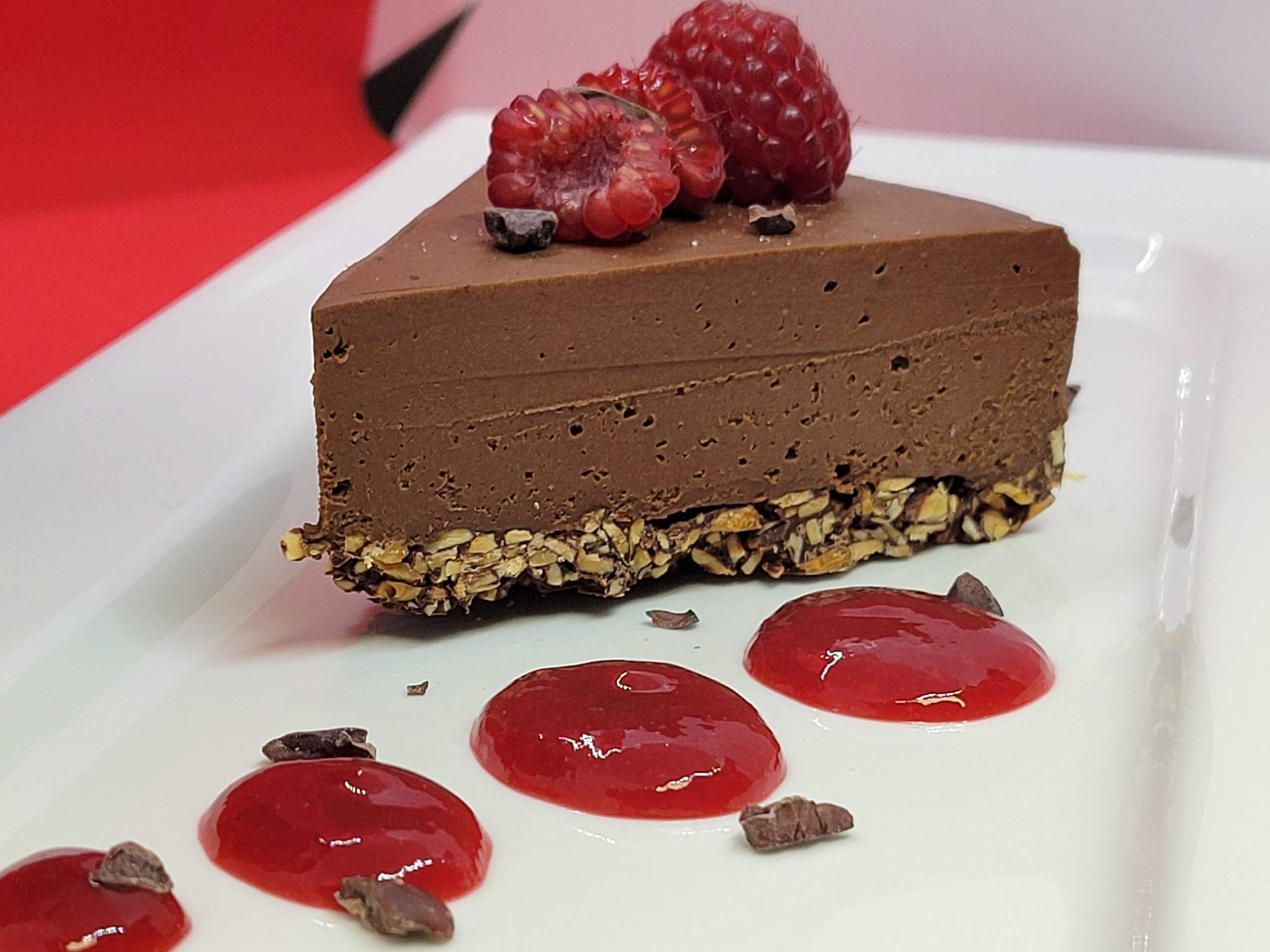 Chocolate Cheesecake With Salted Almond Crust And Raspberry Coulis